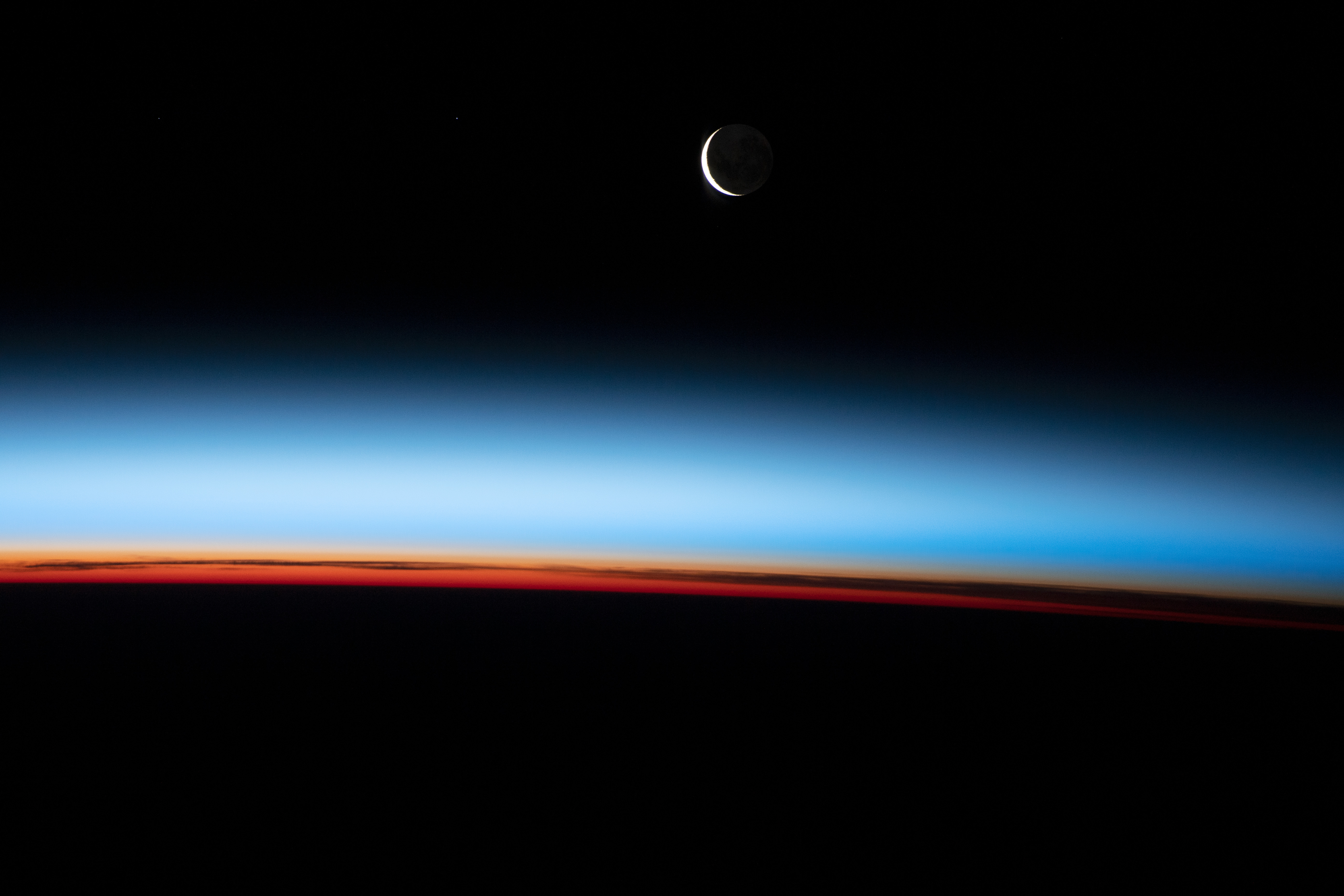 Earth’s Limb with a Crescent Moon